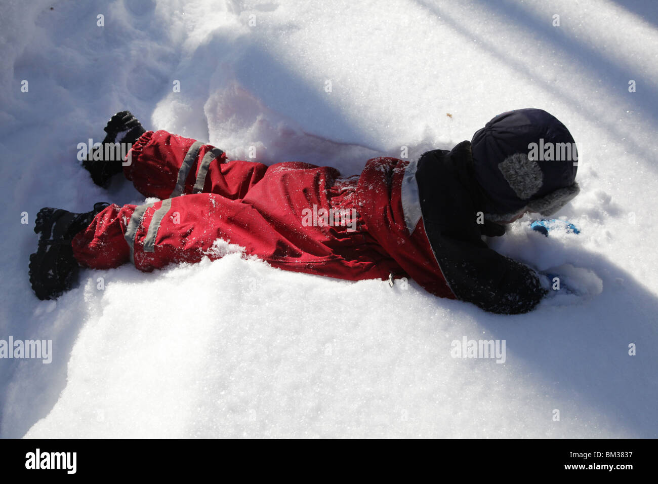 BOY TODDLER FALLS IN DEEP SNOW: Baby toddler falls plays ground path ...