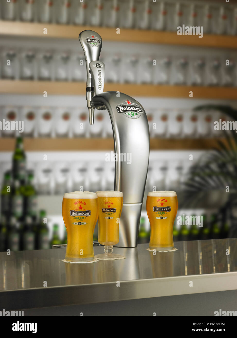 stainless steel bar and beer pump with a glass wall in the background ...