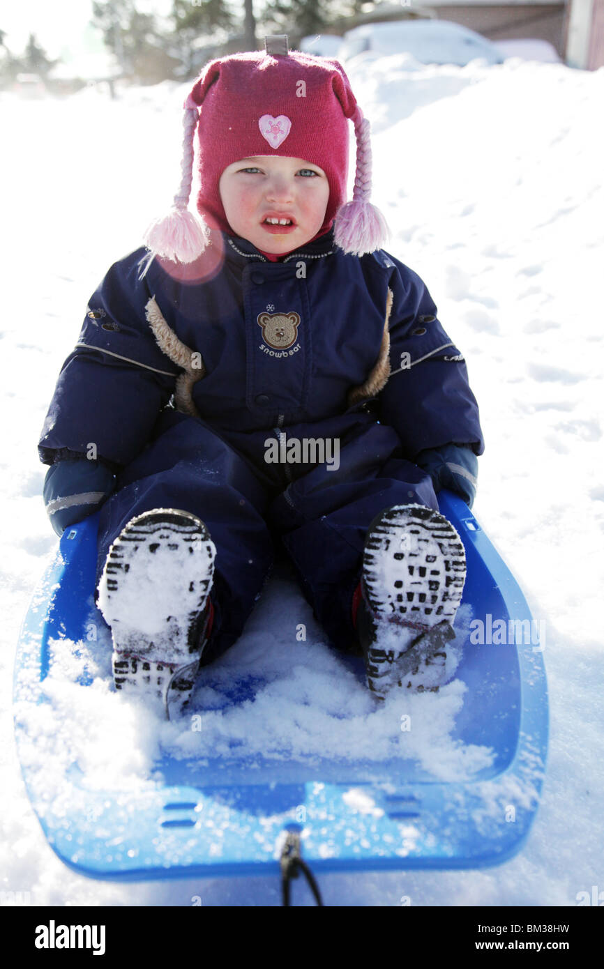 CUTE TODDLER GIRL SAT ON SLEDGE IN DEEP WINTER: Two year old girl baby ...