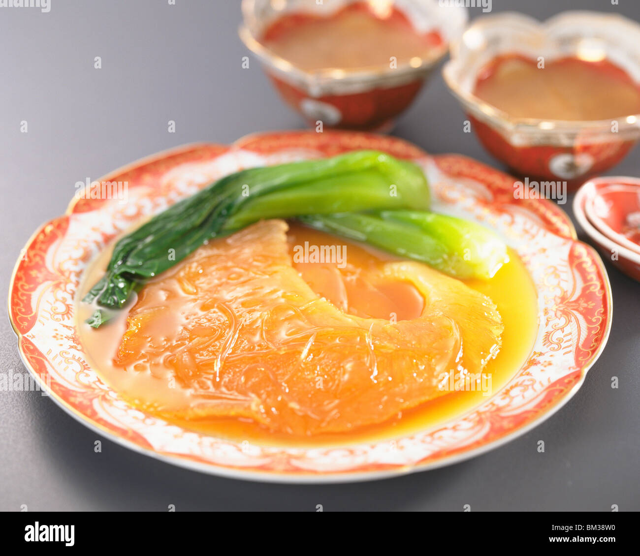 Plate of cooked shark's fins, black background Stock Photo - Alamy