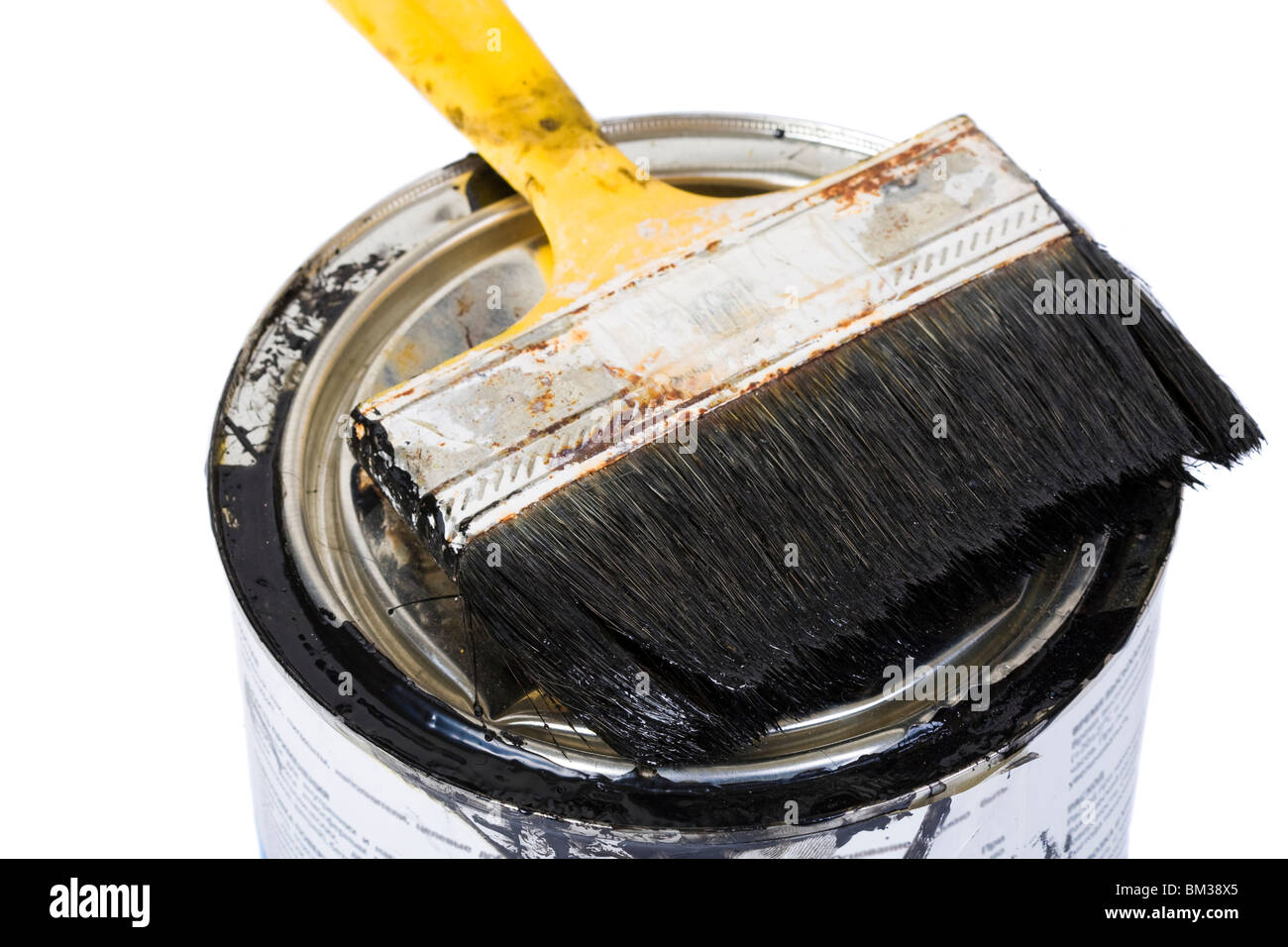 dirty used brush over paint can, isolated Stock Photo - Alamy