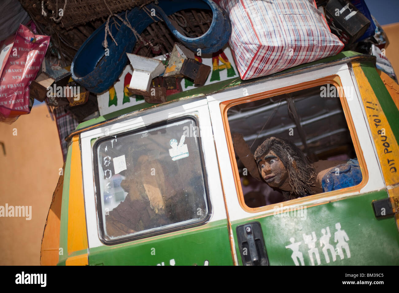 Exhibit of a "bush taxi" loaded with passengers and cargo at the ...