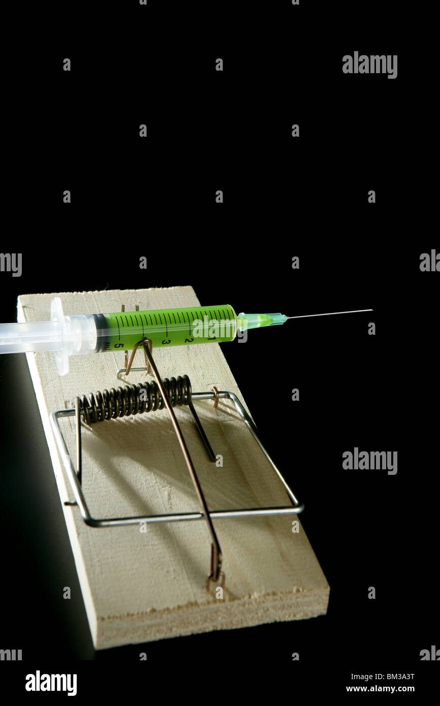 Drugs and medicine addiction metaphor. Color syringe on mouse trap ...