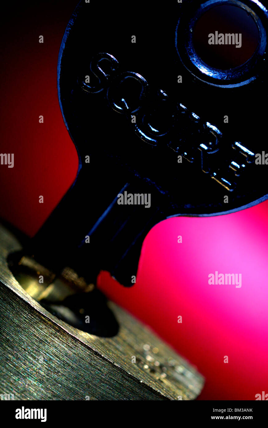 Key in padlock Stock Photo - Alamy