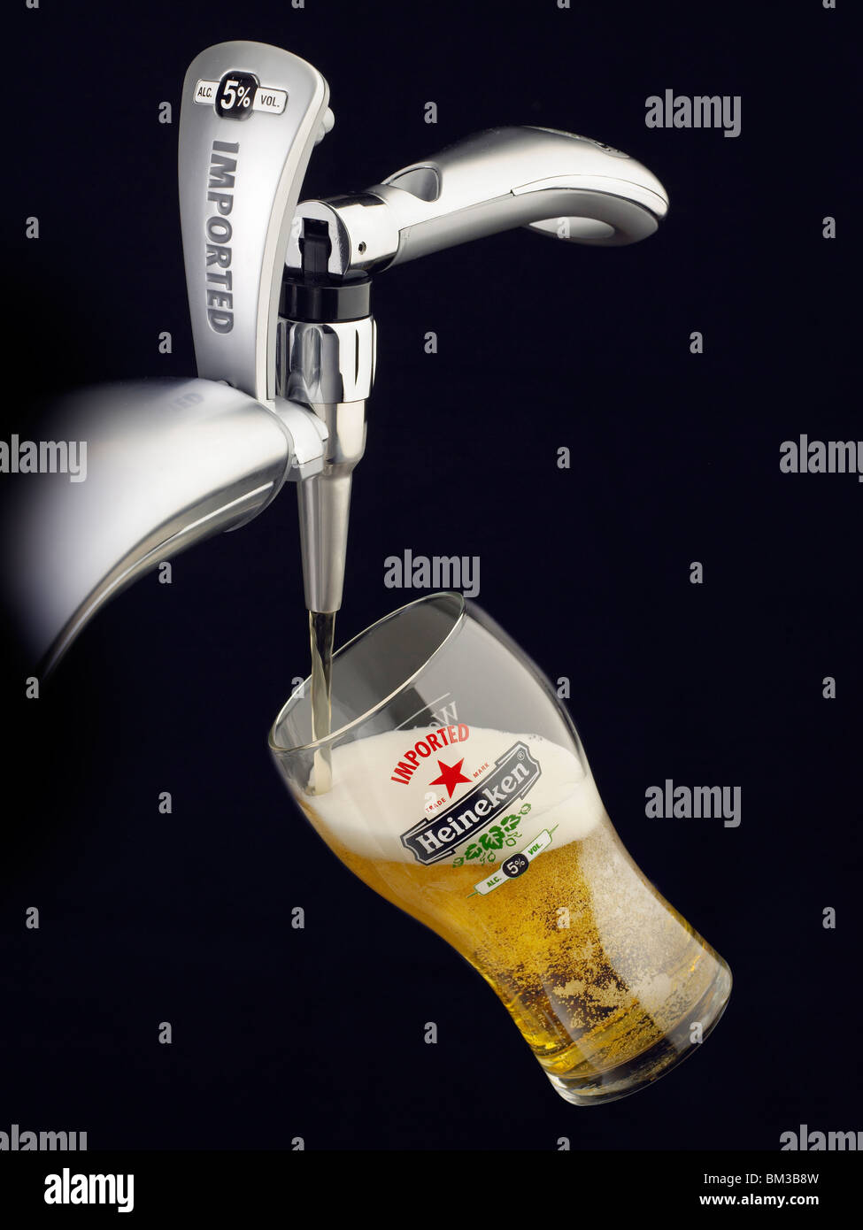 Pint of beer being pulled Stock Photo - Alamy