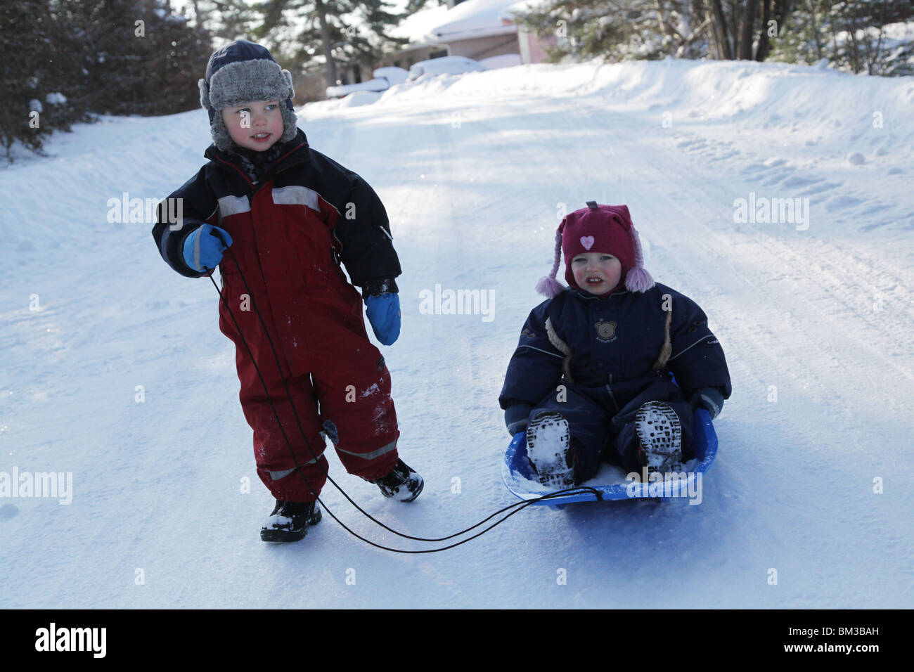 Two children with slides hi-res stock photography and images - Alamy