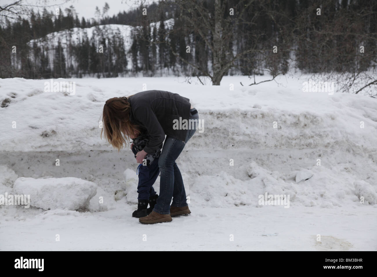 ROADSIDE TOILET BREAK WINTER CHILD: A two year old baby boy child takes ...