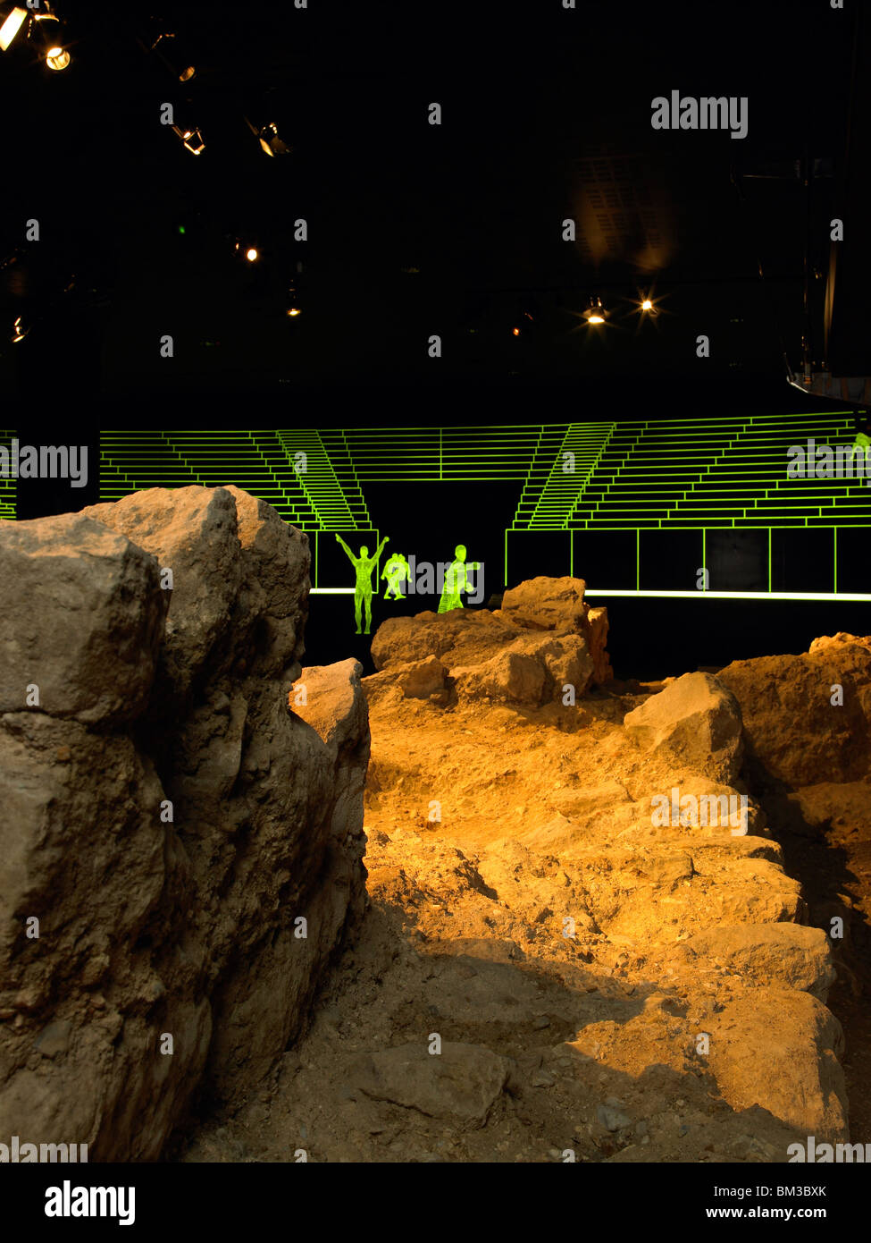 neon figures in a roman underground display featuring remains of ...