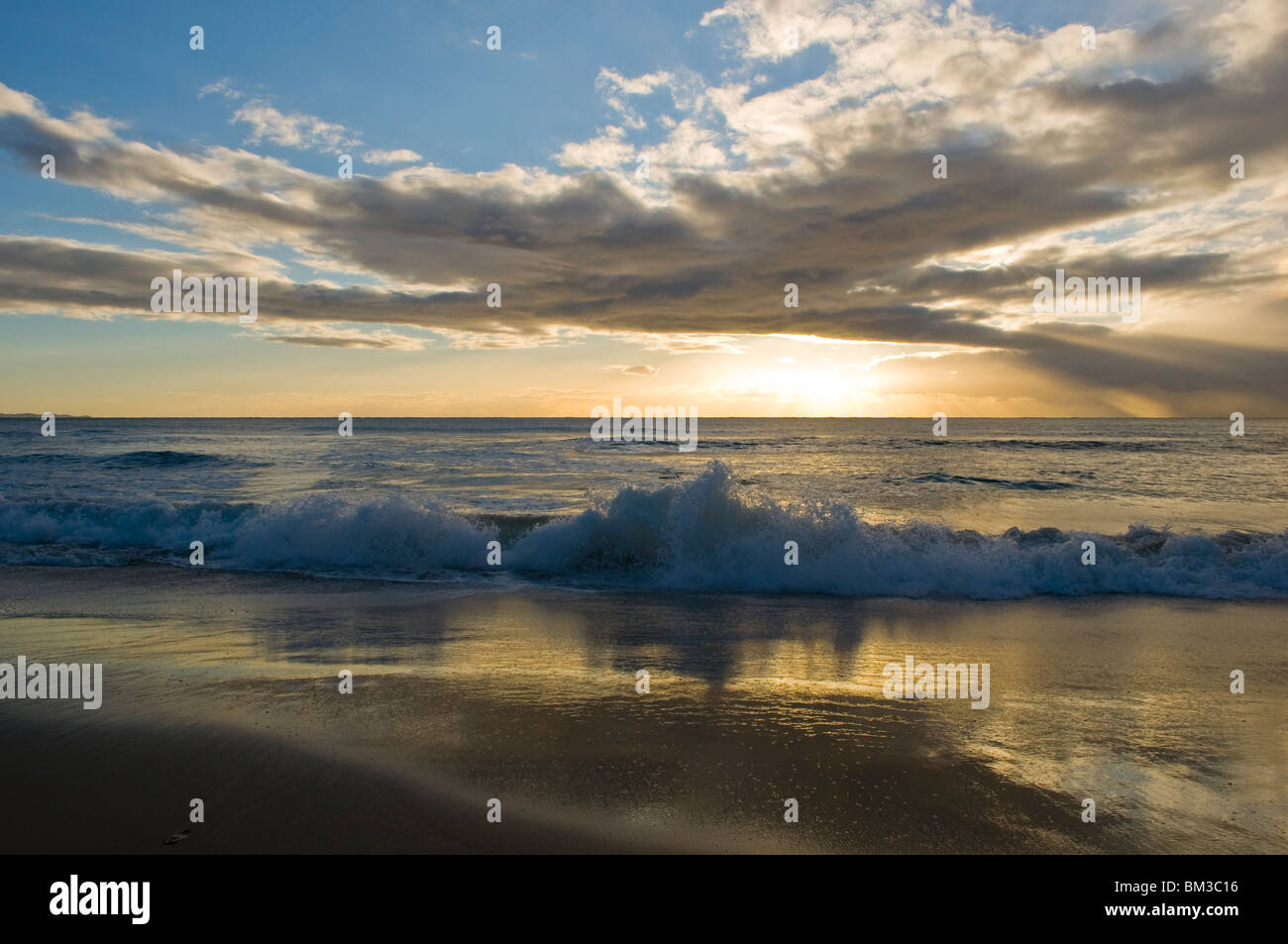 Crisp beach sunrise Stock Photo - Alamy
