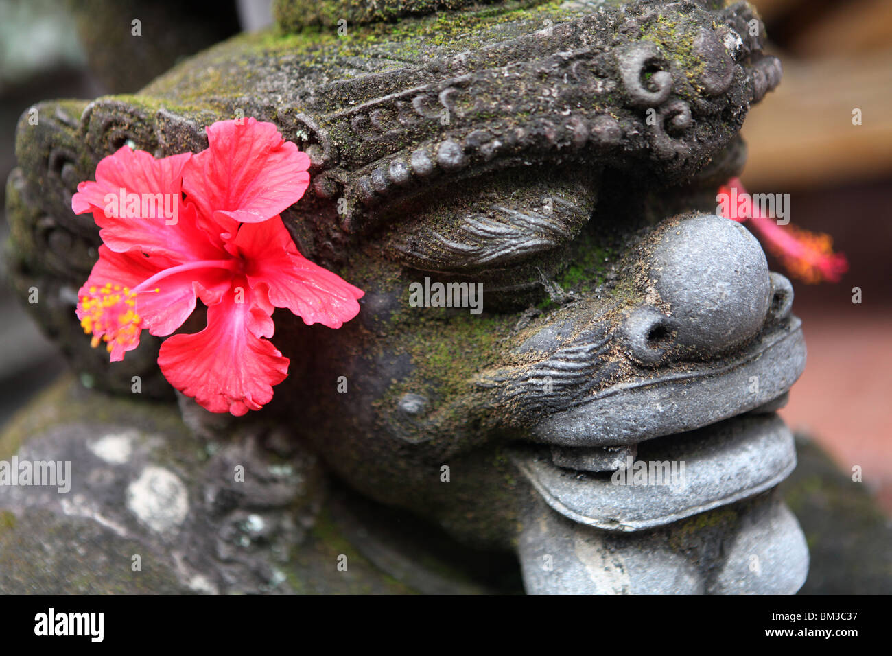 A statue welcomes visitors to a traditional house in Ubud, Bali ...
