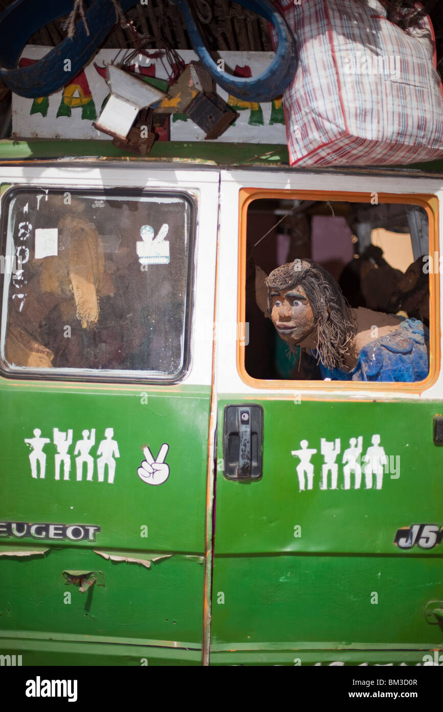 Exhibit of a "bush taxi" loaded with passengers and cargo at the ...