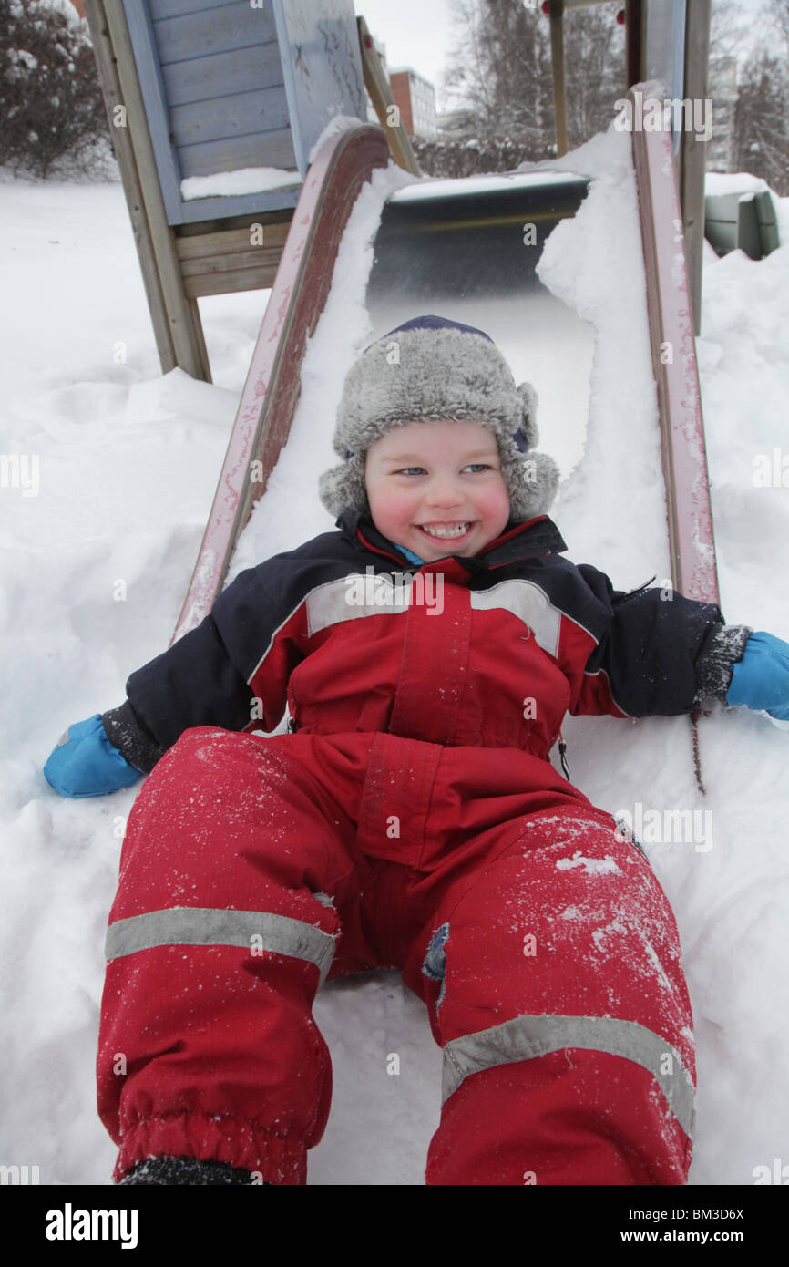TODDLER BABY BOY PLAYING ON A SLIDE IN DEEP WINTER: A two year old baby ...