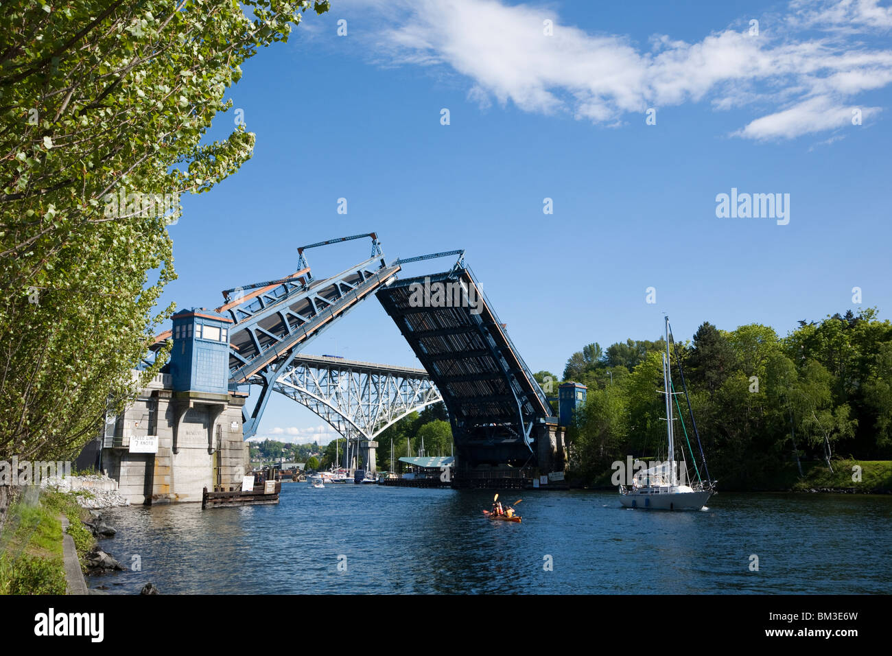 The Fremont Bridge - open to let boats pass. Kayak and Sailboat in ...