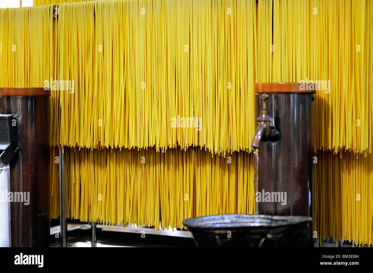 Spaghetti hanging to dry Stock Photo - Alamy