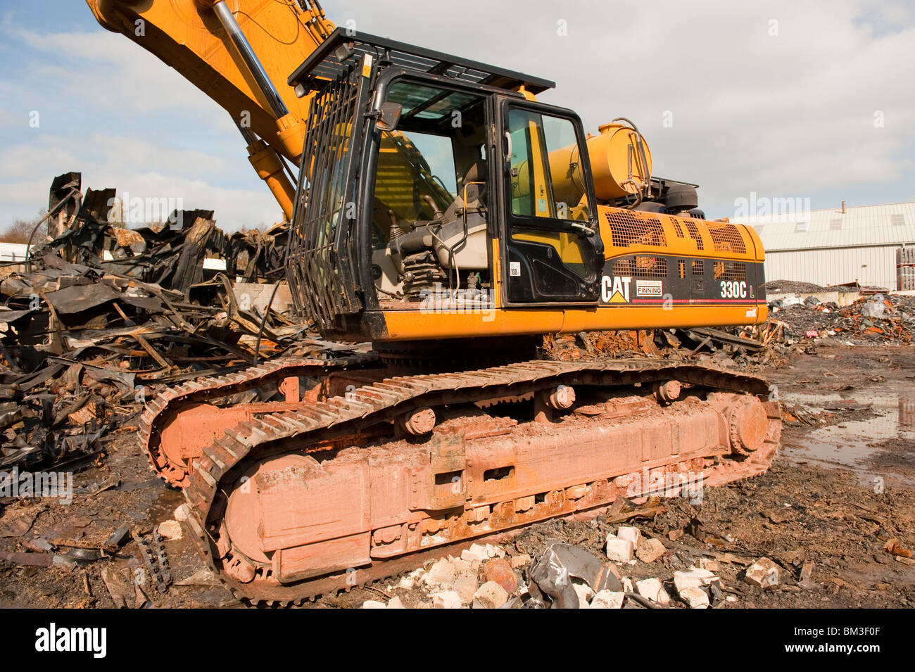 CAT 330C L Tracked digger on demolition site Stock Photo - Alamy