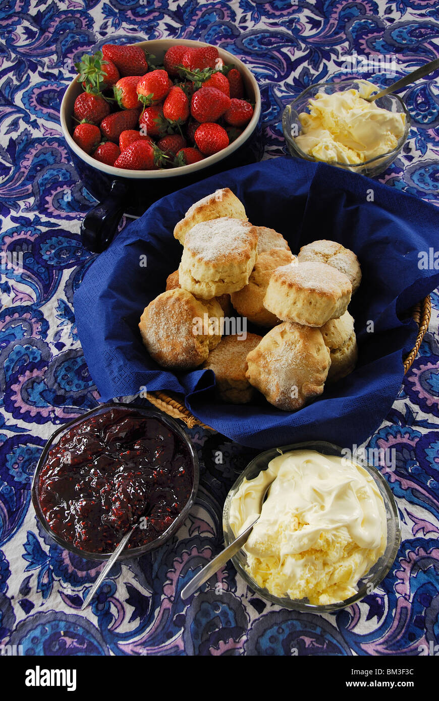English cream tea with scones, jam and clotted cream Stock Photo - Alamy