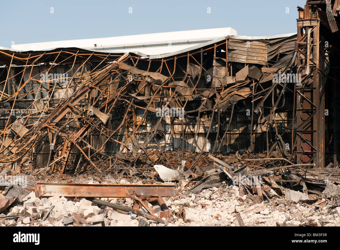 Melted steel girders at factory fire Stock Photo - Alamy