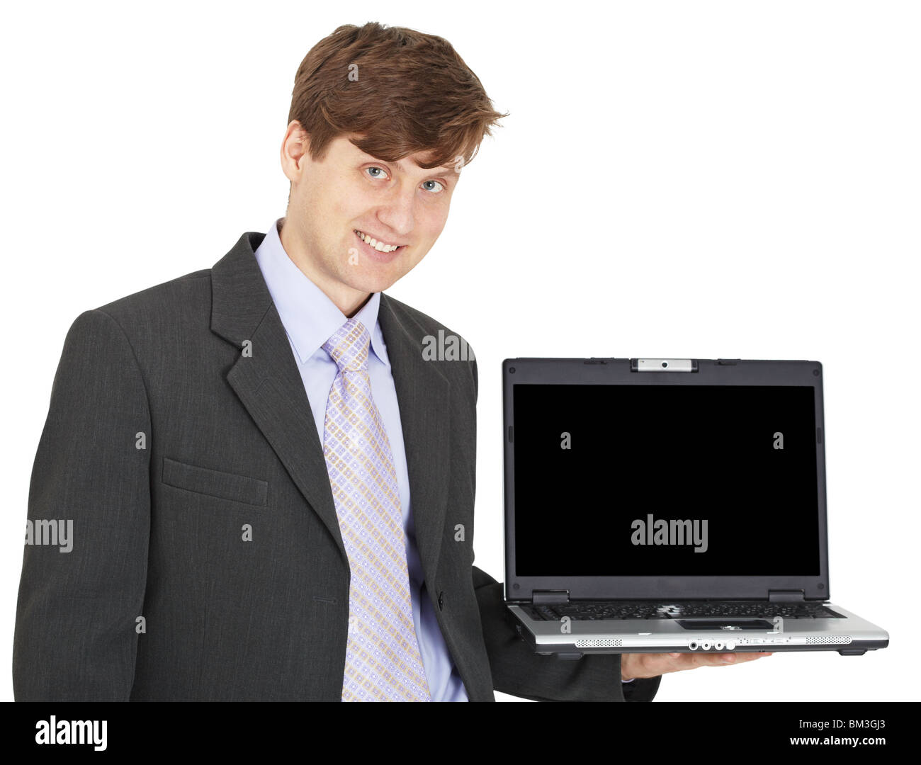 Friendly smiling person holds the laptop on a hand isolated on white ...