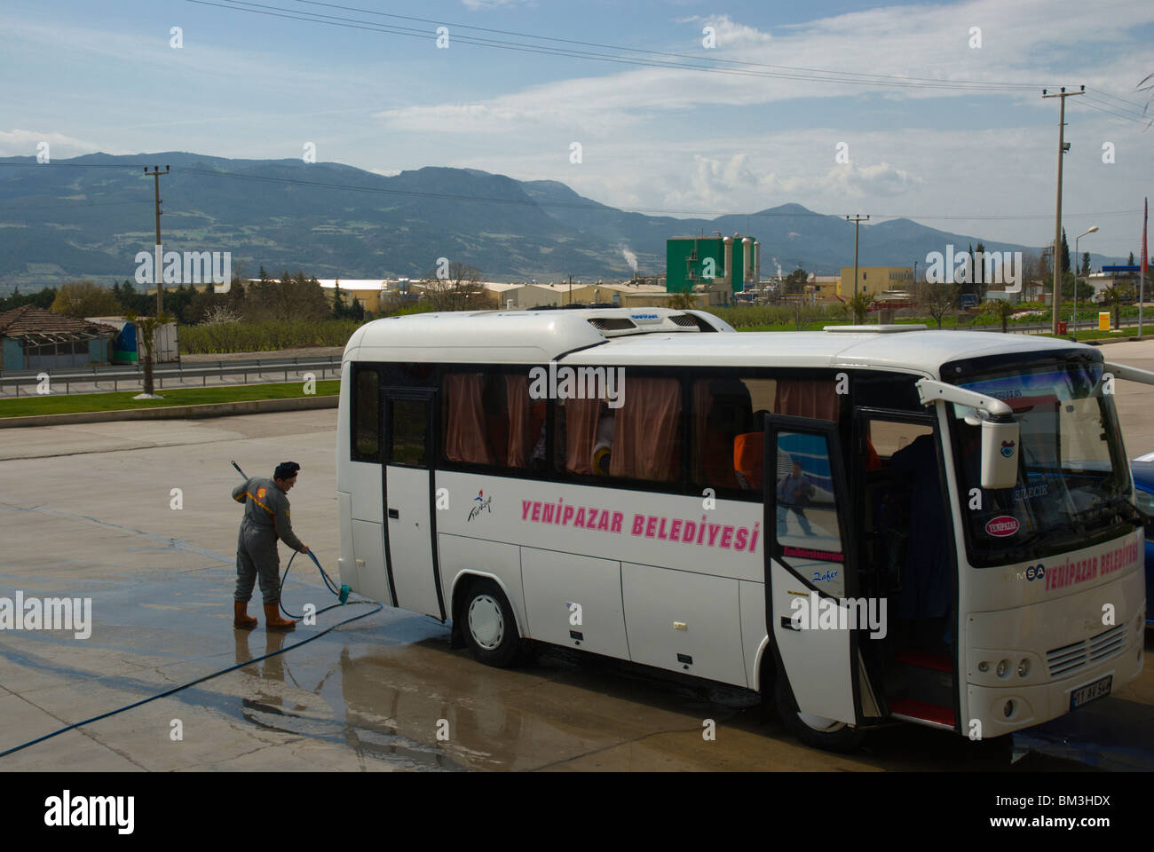Man washing a minibus at a rest stop central Turkey Stock Photo - Alamy