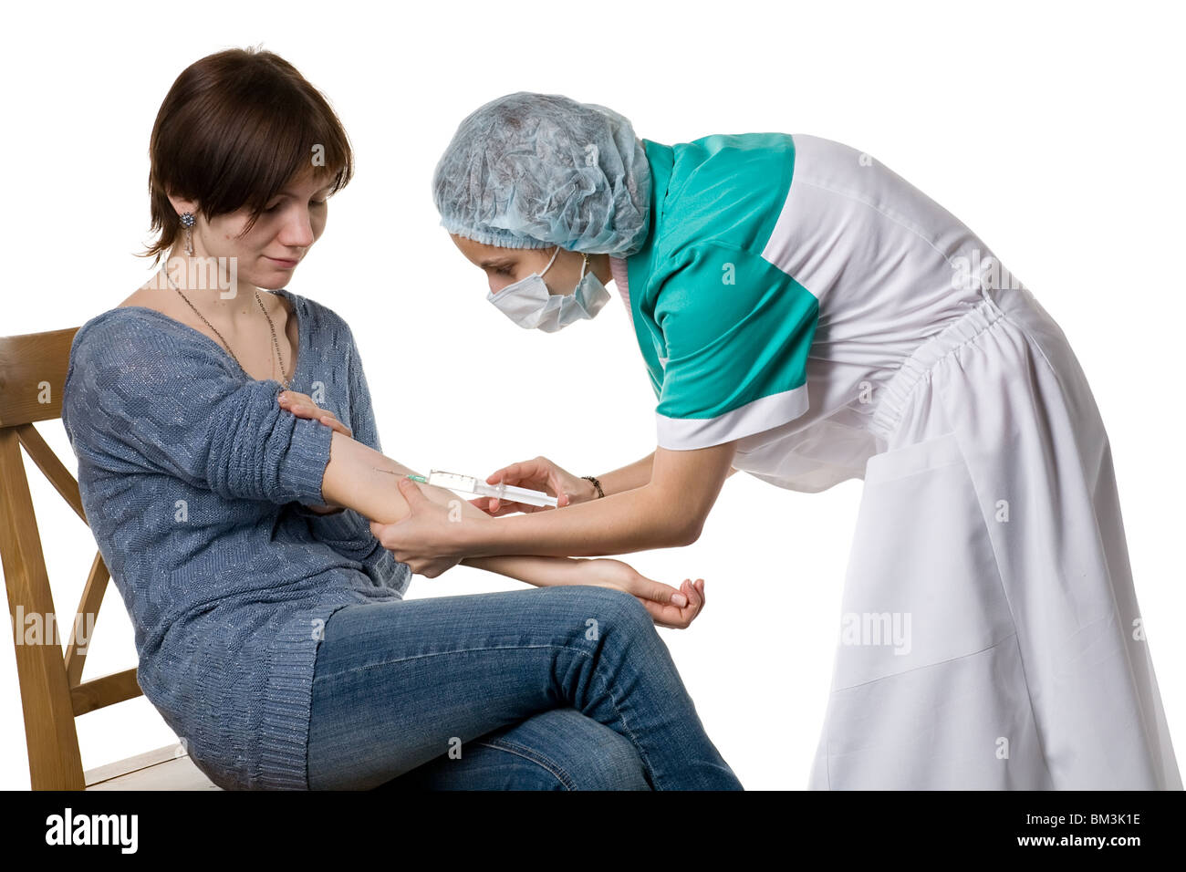 A doctor injects to the patient, isolated on white Stock Photo - Alamy