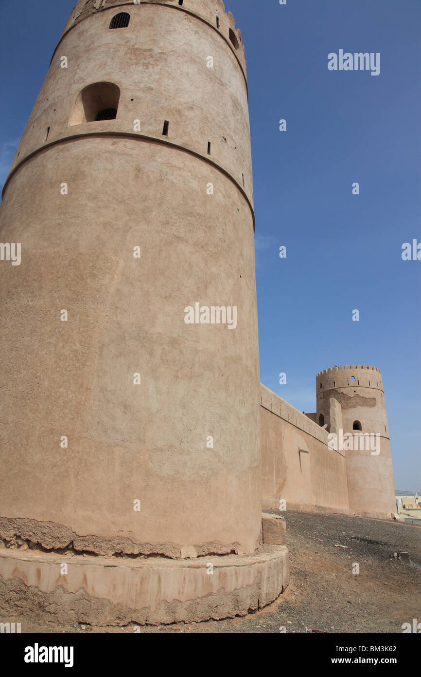 restored tower and outside fortified wall of historic Fort Al-Suwaiq in ...