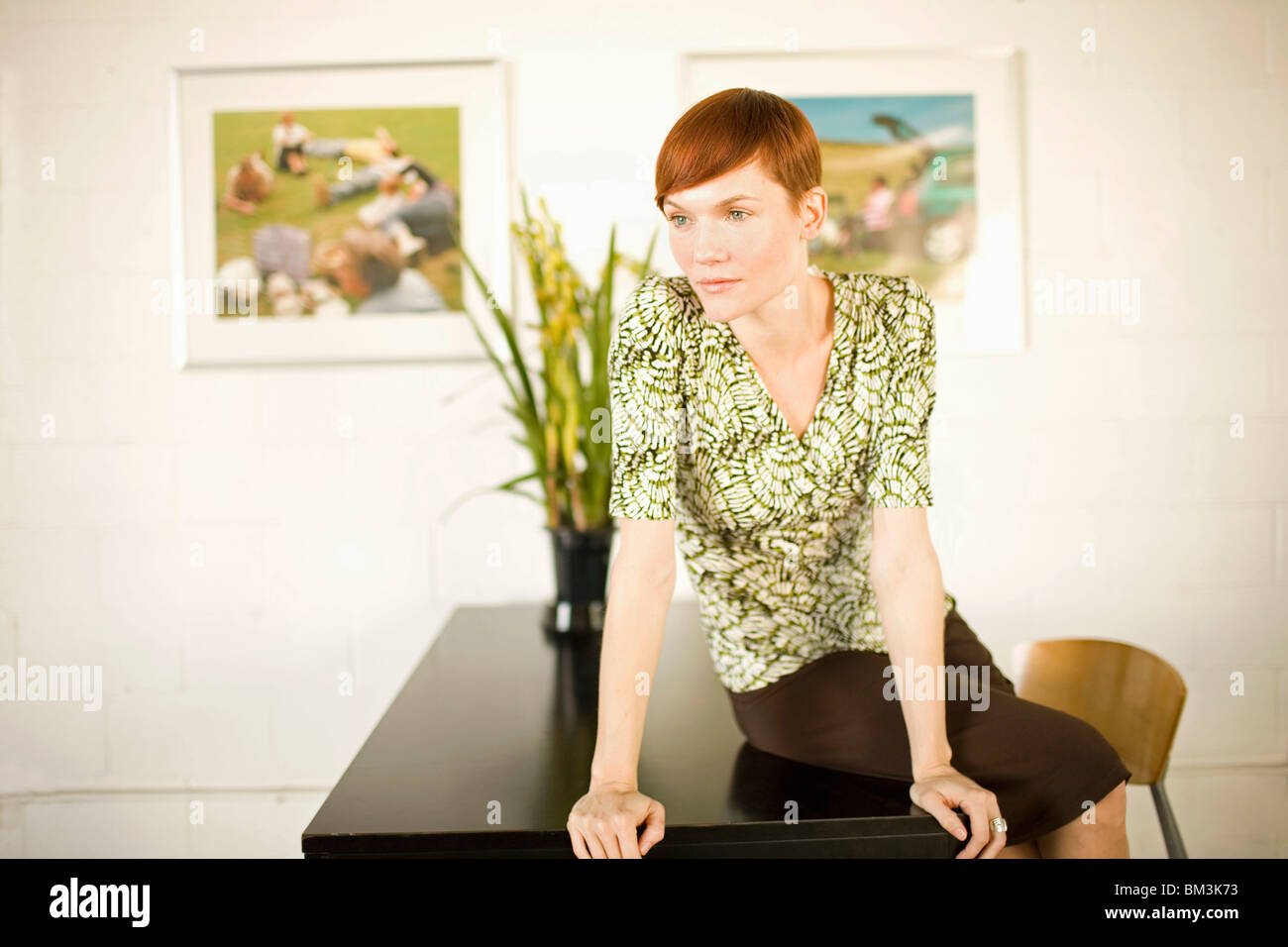 Art Gallery Owner with photo exhibit Stock Photo - Alamy