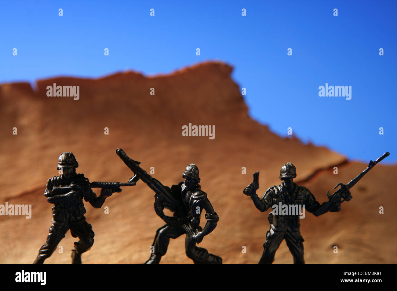War metaphor, toy little soldiers fighting on wooden mountain Stock ...