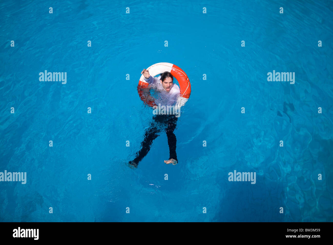 Man in a lifesaver Stock Photo - Alamy