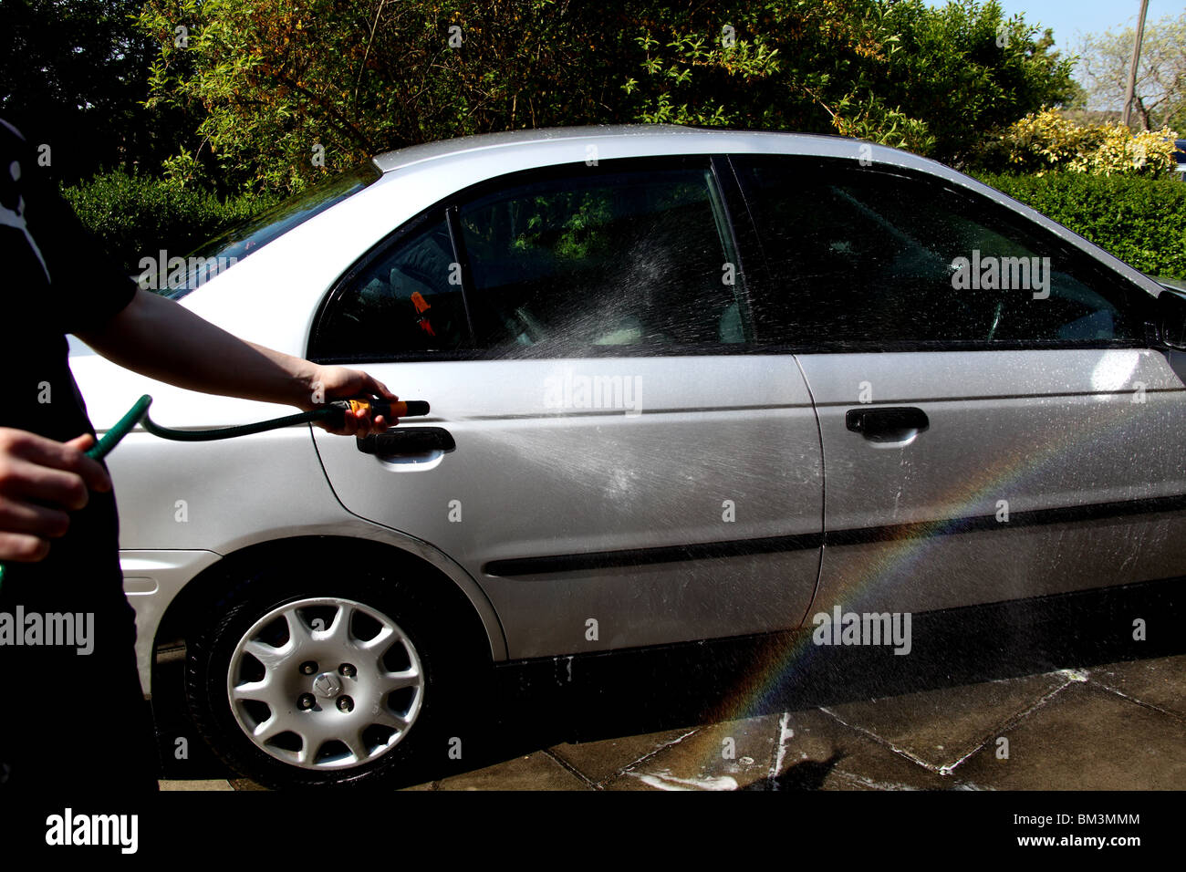 Washing a car with a hose pipe hi-res stock photography and images - Alamy