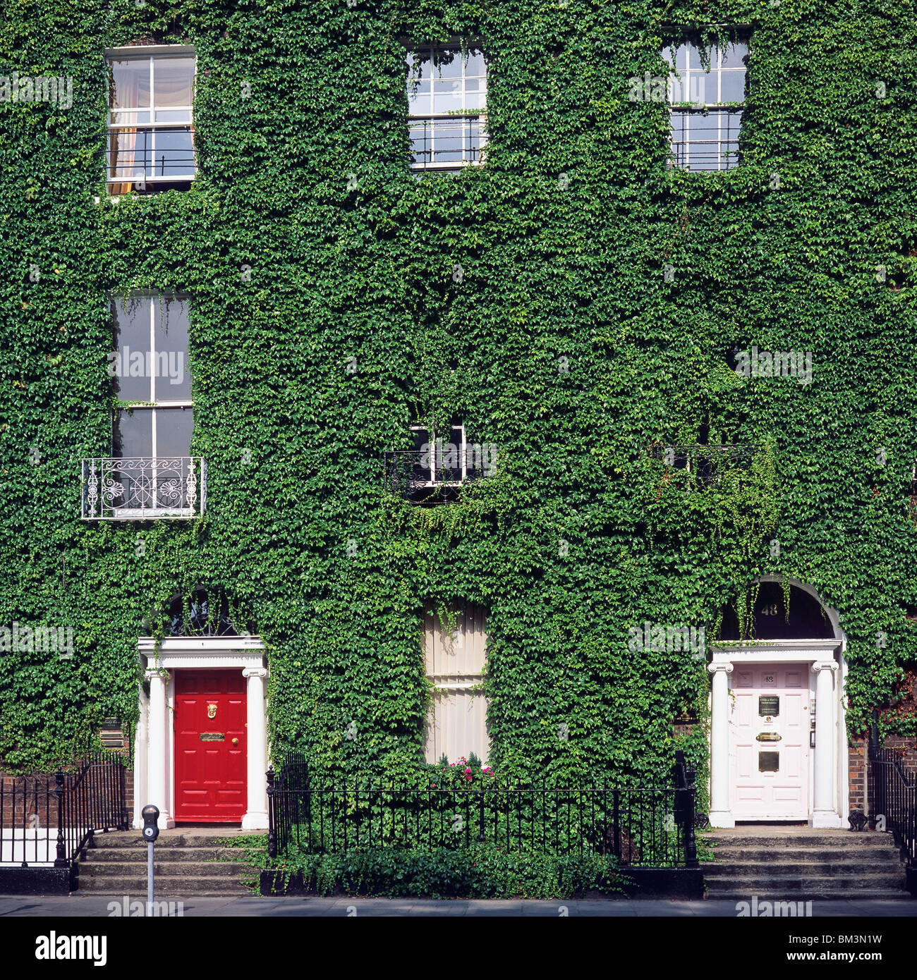 Flat building with green doors and windows hi-res stock photography and ...