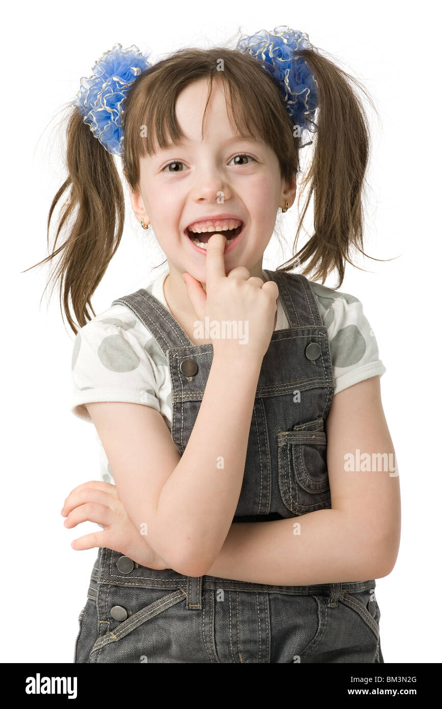 Little smiling girl holds finger in the mouth, isolated on white Stock ...