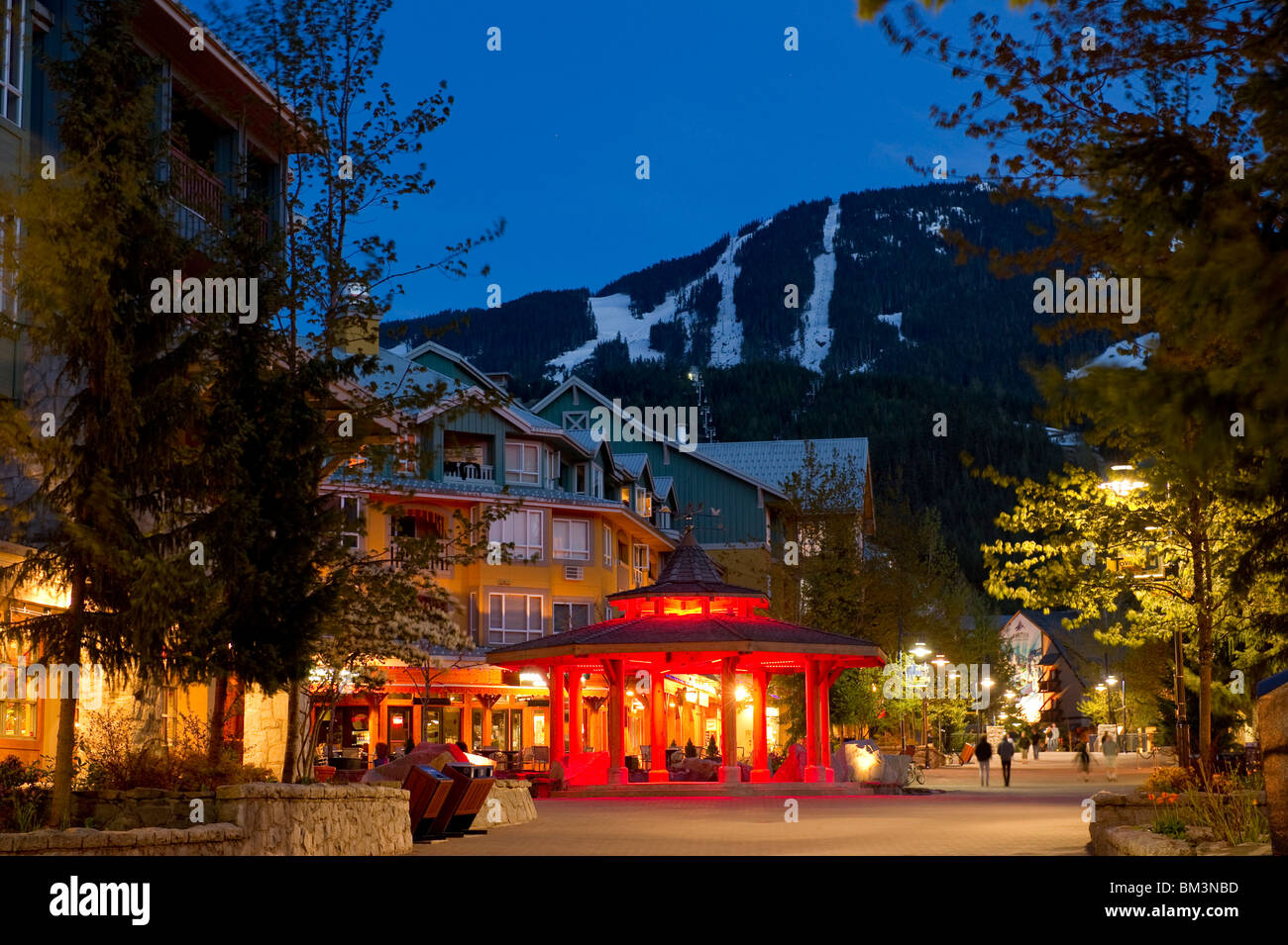 Town Plaza in Whistler Village at Dusk with Whistler Mountain in the ...