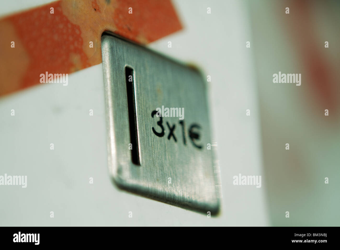 Drop slot for coins on a vending machine Stock Photo - Alamy