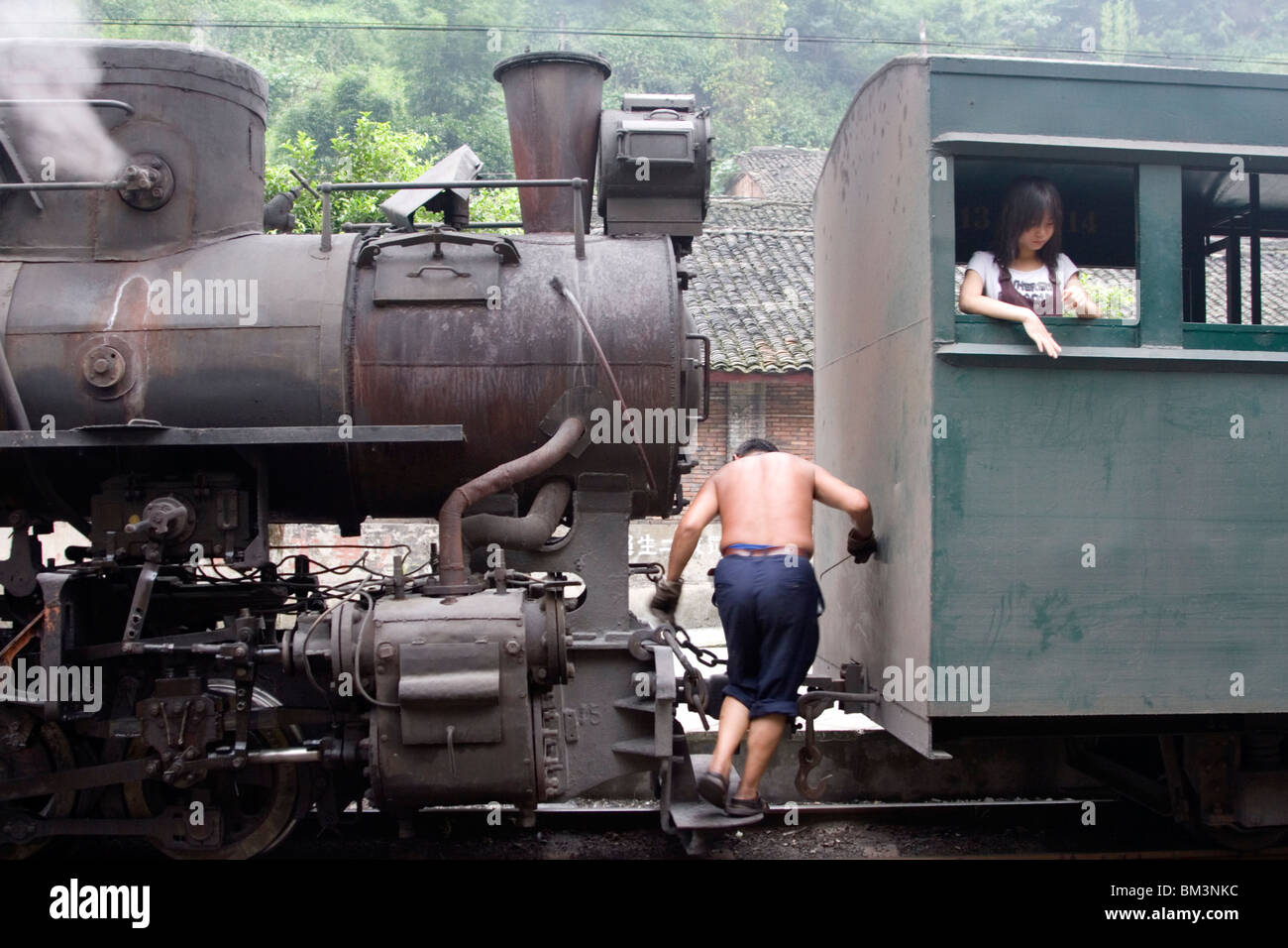 Steam train changing direction at the end of the line and being coupled ...