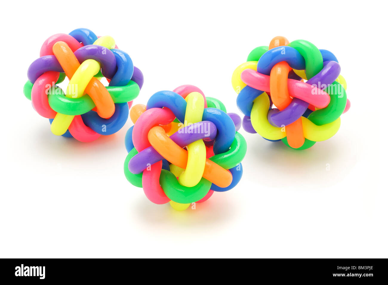 Three colorful rubber rings balls on white background Stock Photo - Alamy