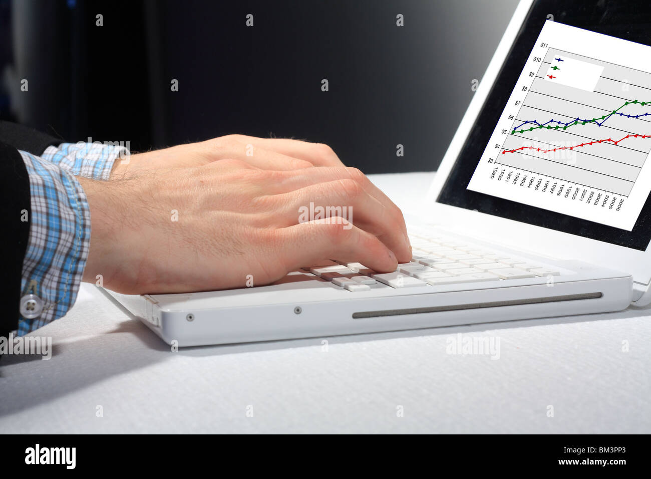 Busy business man doing some computer work Stock Photo - Alamy