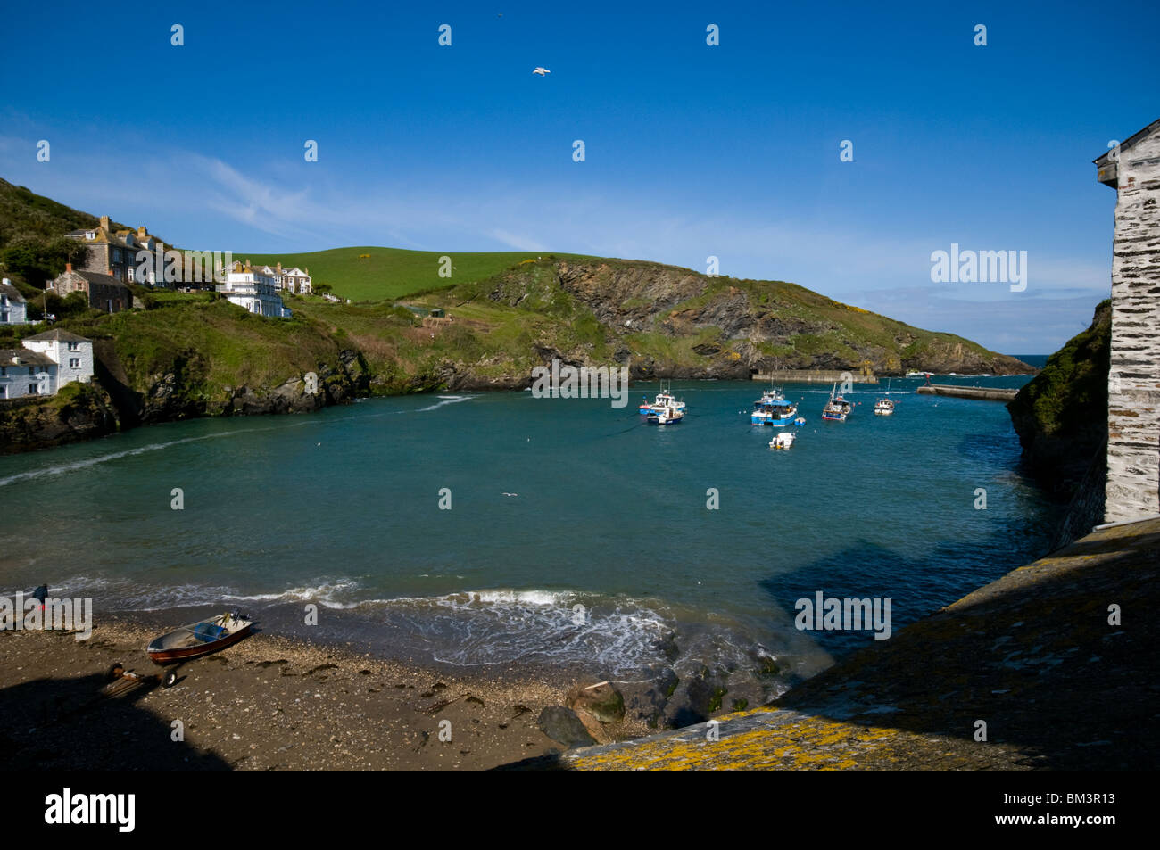 The harbour at the fishing village of Port Isaac in Cornwall, England ...