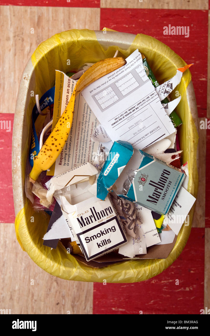 Packs of Marlboro cigarettes are seen in the trash on Saturday, May 8 ...