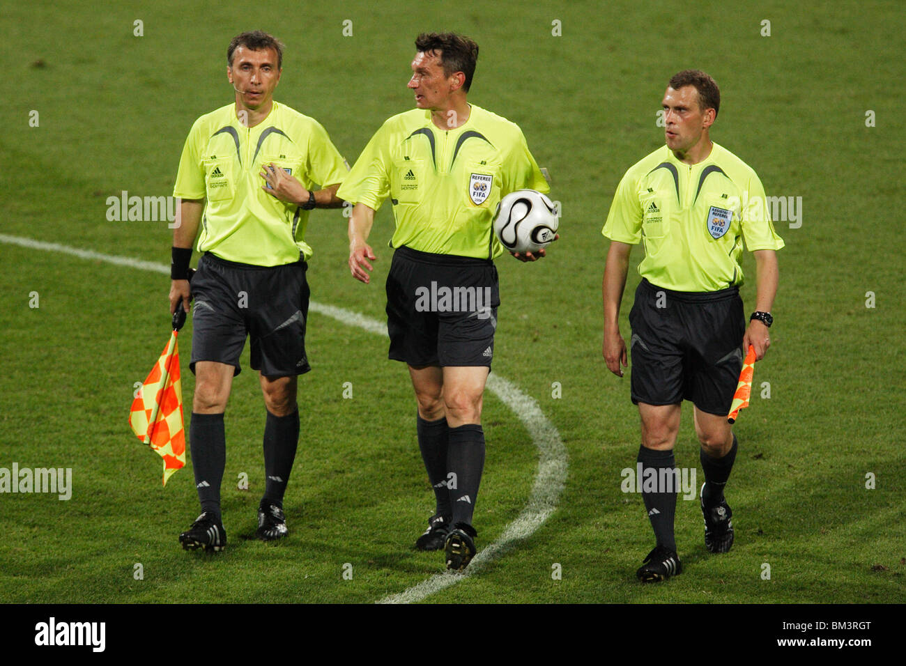 Referee Valentin Ivanov (c) exits the field with his assistants at ...