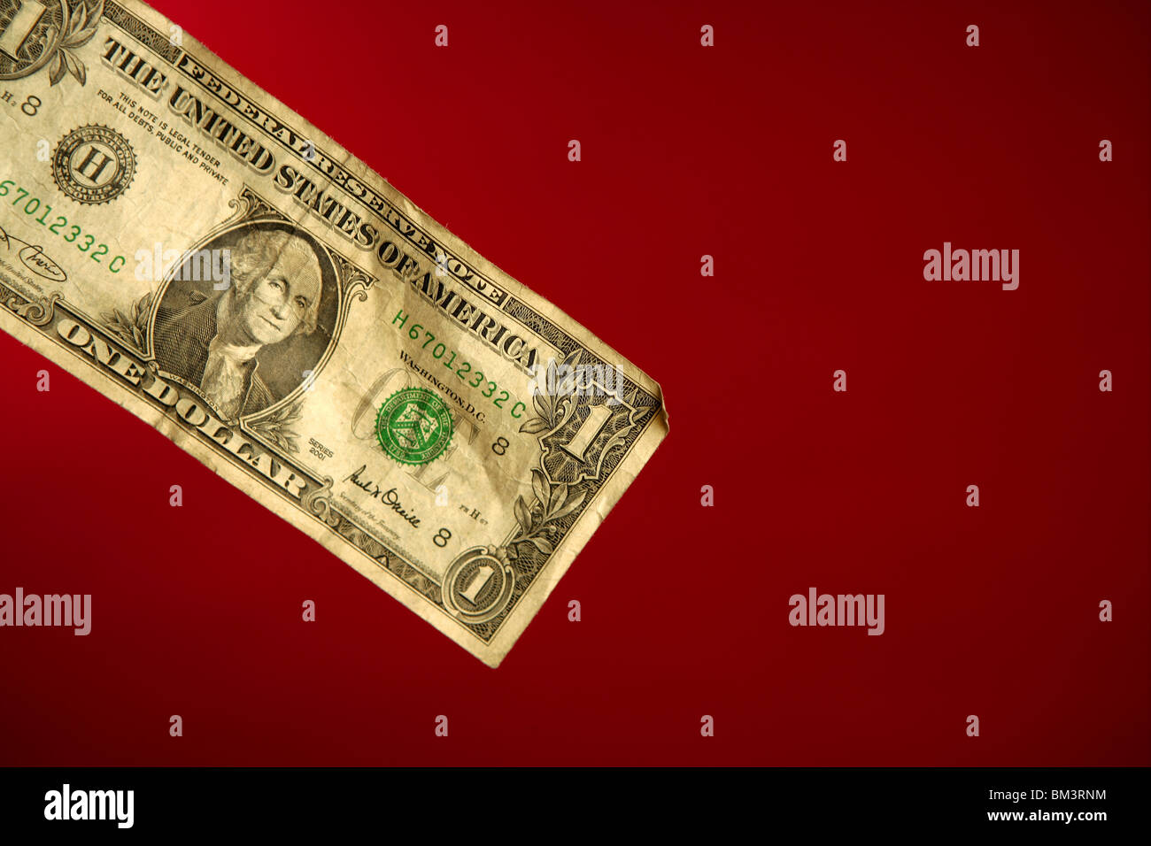 One dollar note over red background, studio crop shot Stock Photo - Alamy