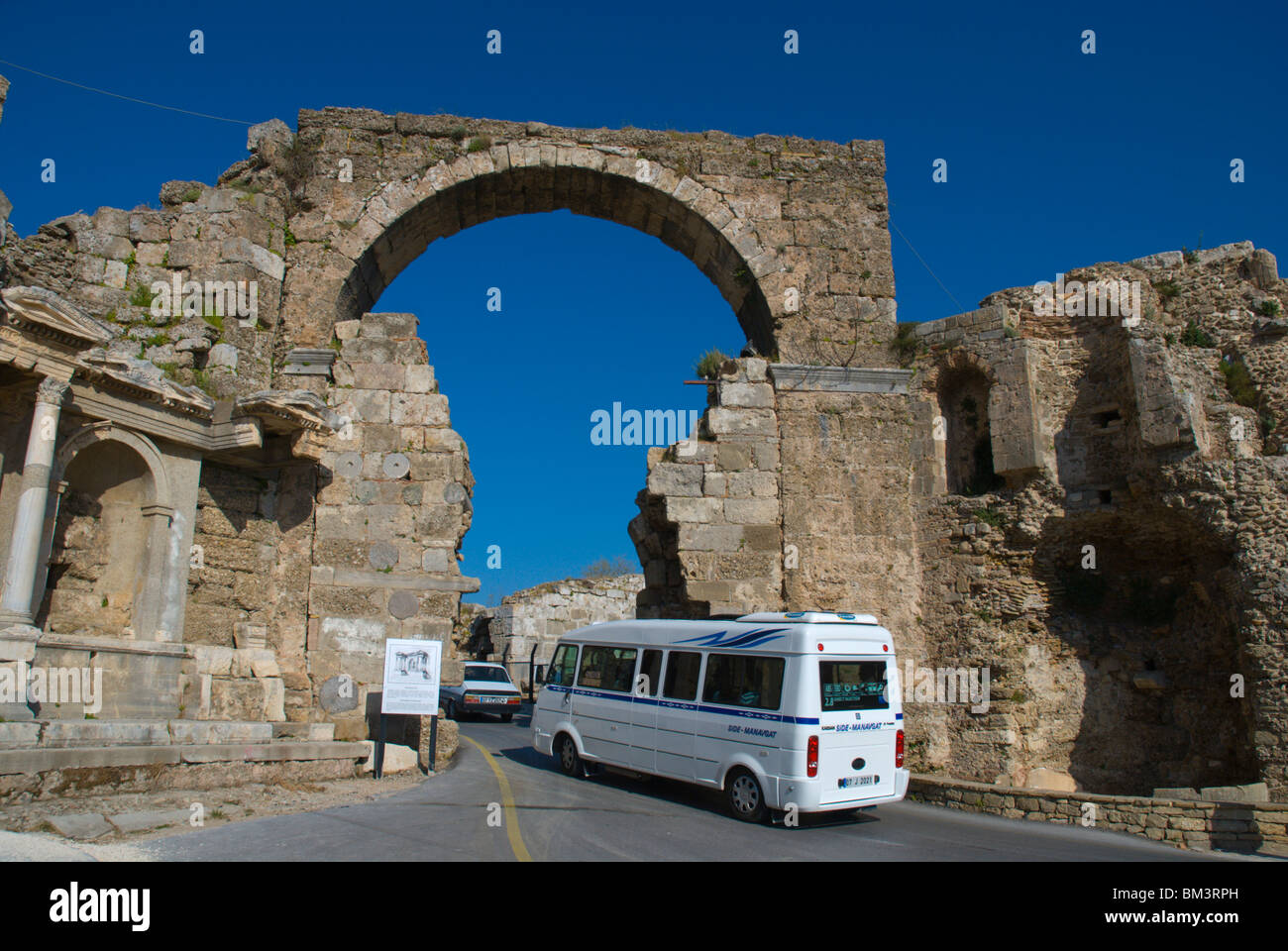 Dolmus minibus going through ancient hi-res stock photography and ...
