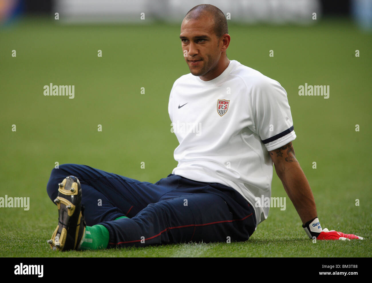 United States goalkeeper Tim Howard stretches during team warm-ups ...