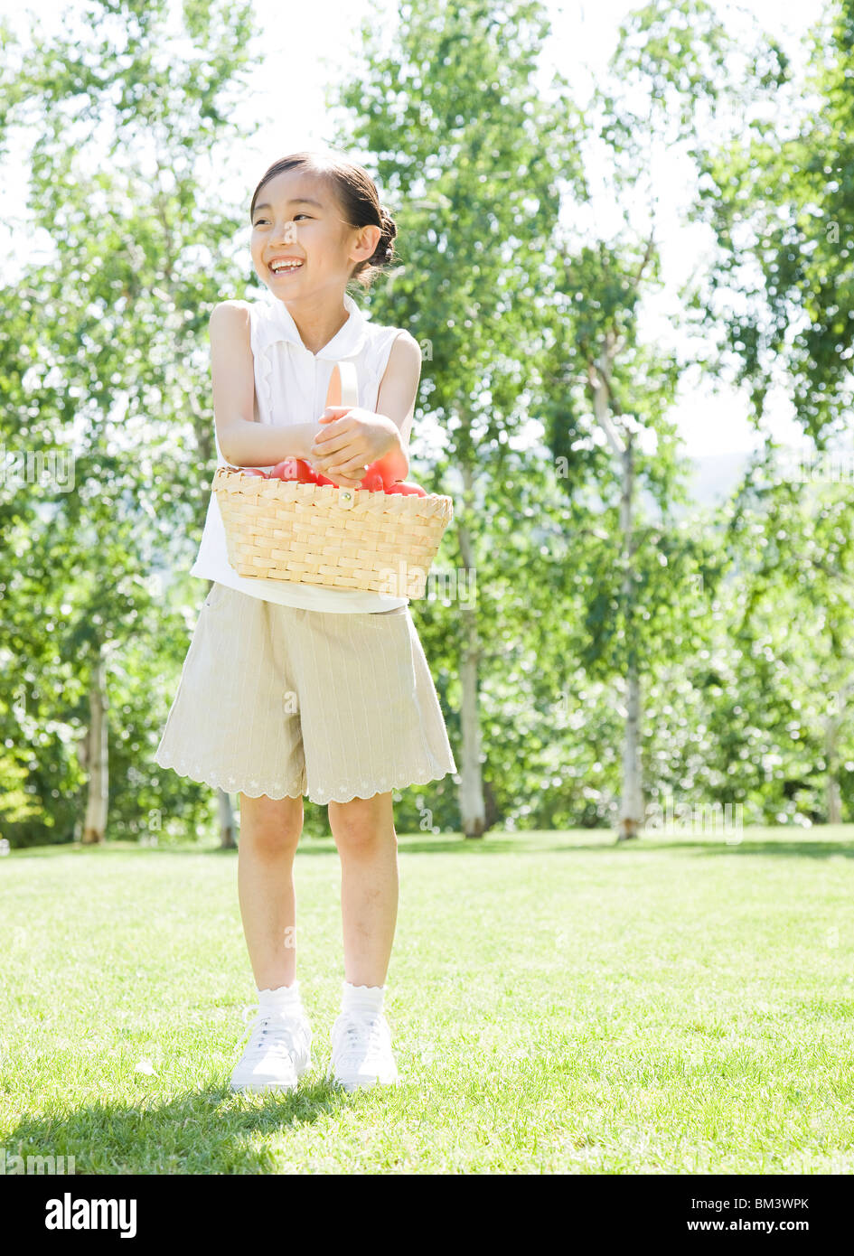 A Girl Holding Basket Stock Photo - Alamy