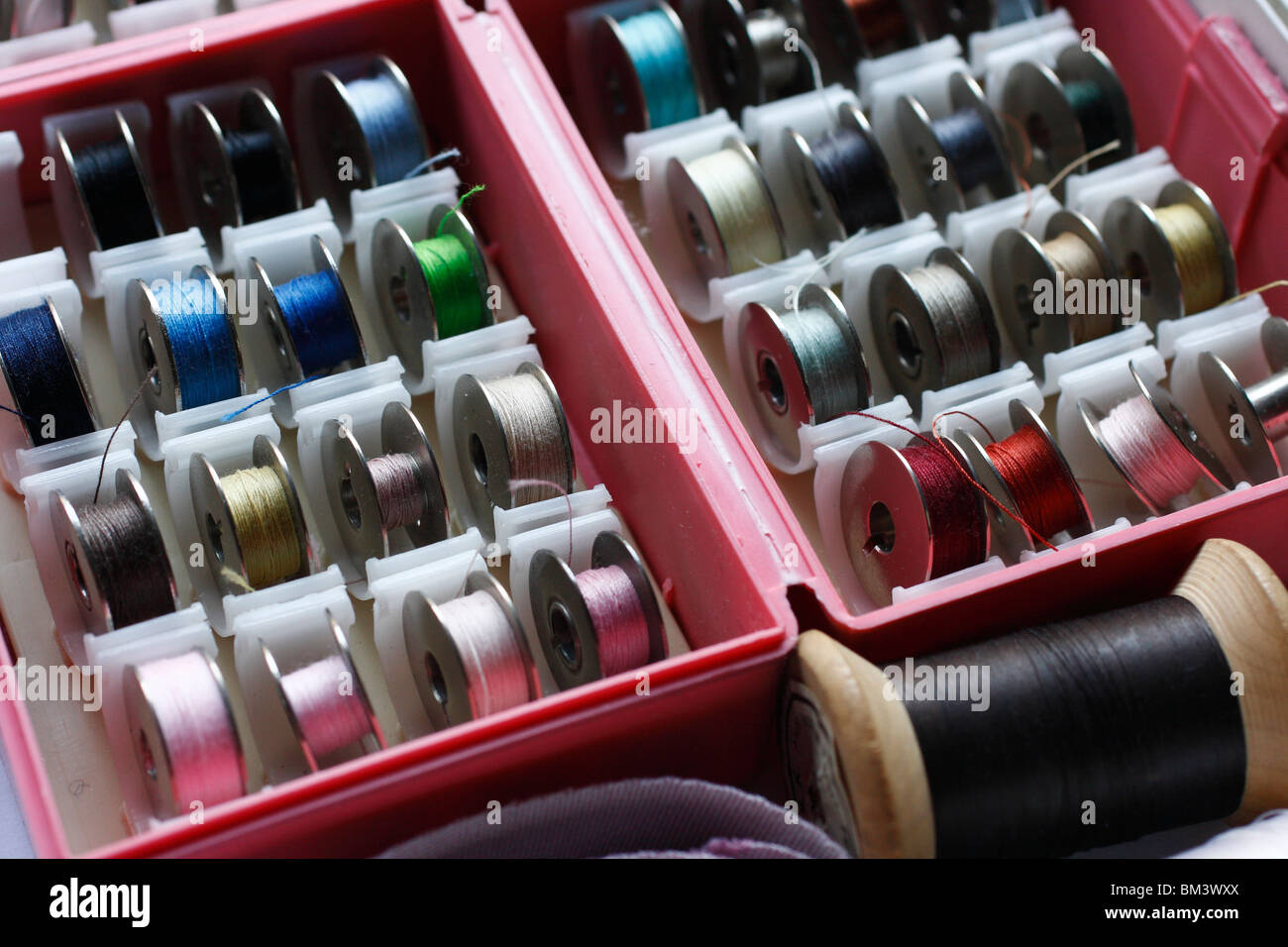 Spools of thread in box Stock Photo - Alamy