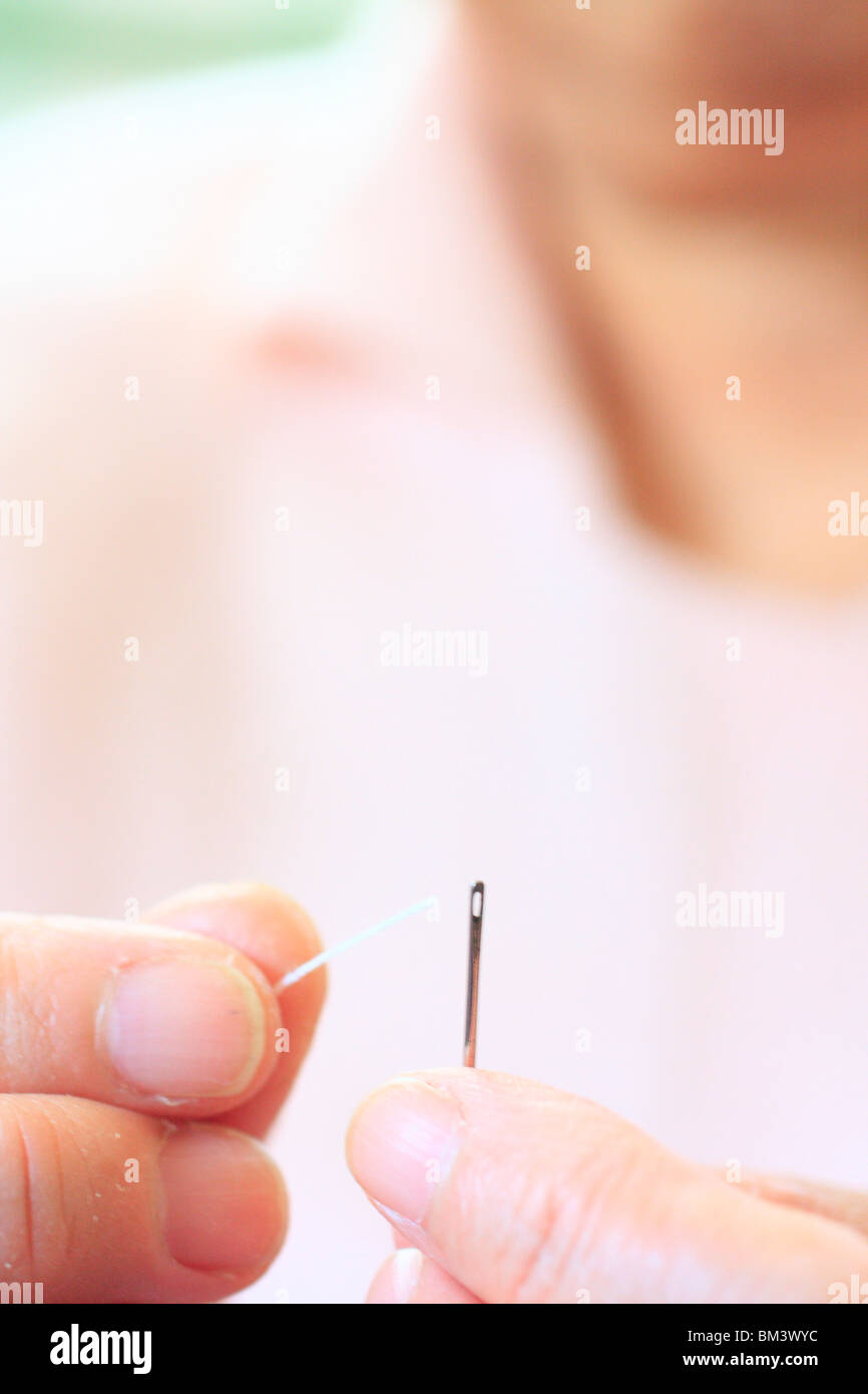 Threading needle hi-res stock photography and images - Alamy
