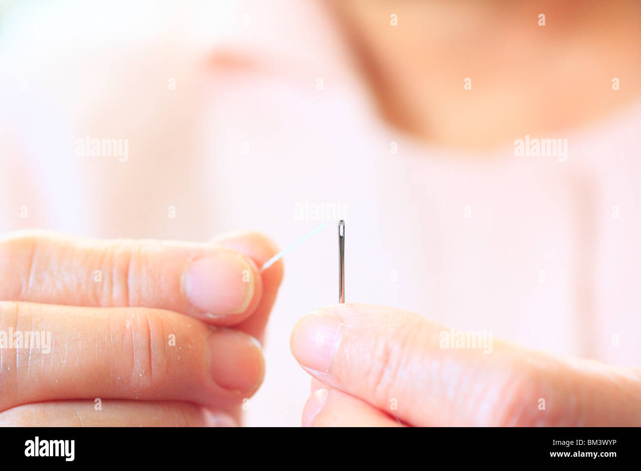 Threading needle thread hi-res stock photography and images - Alamy