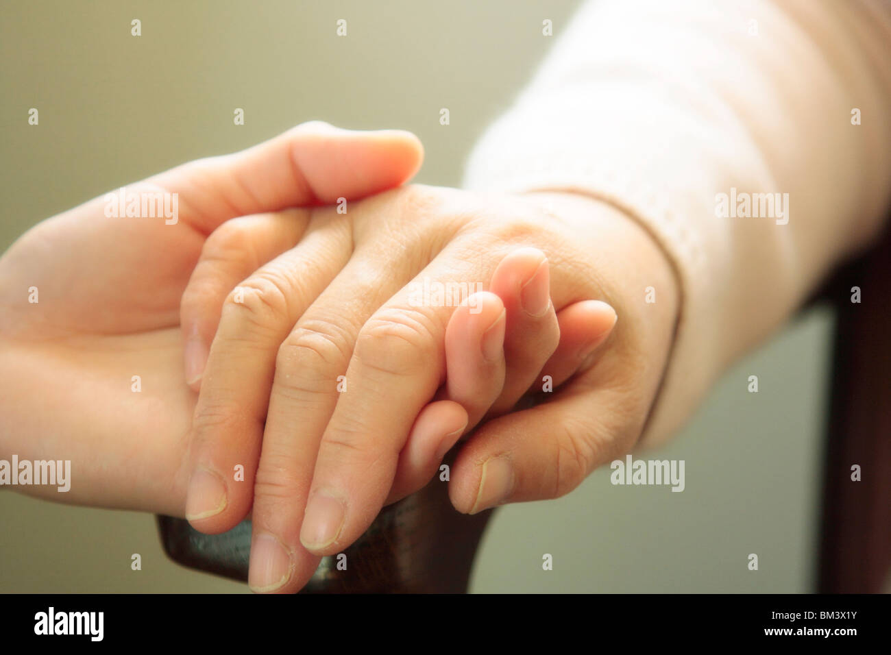 Two women hand in hand hi-res stock photography and images - Alamy