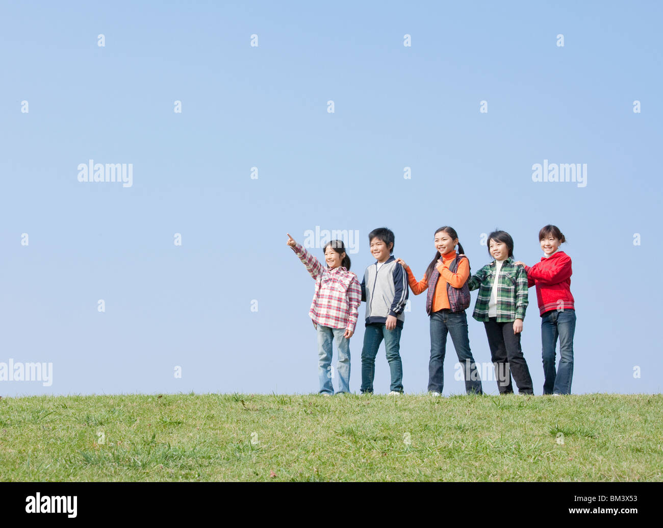 Boys and Girls Standing In Line Stock Photo - Alamy