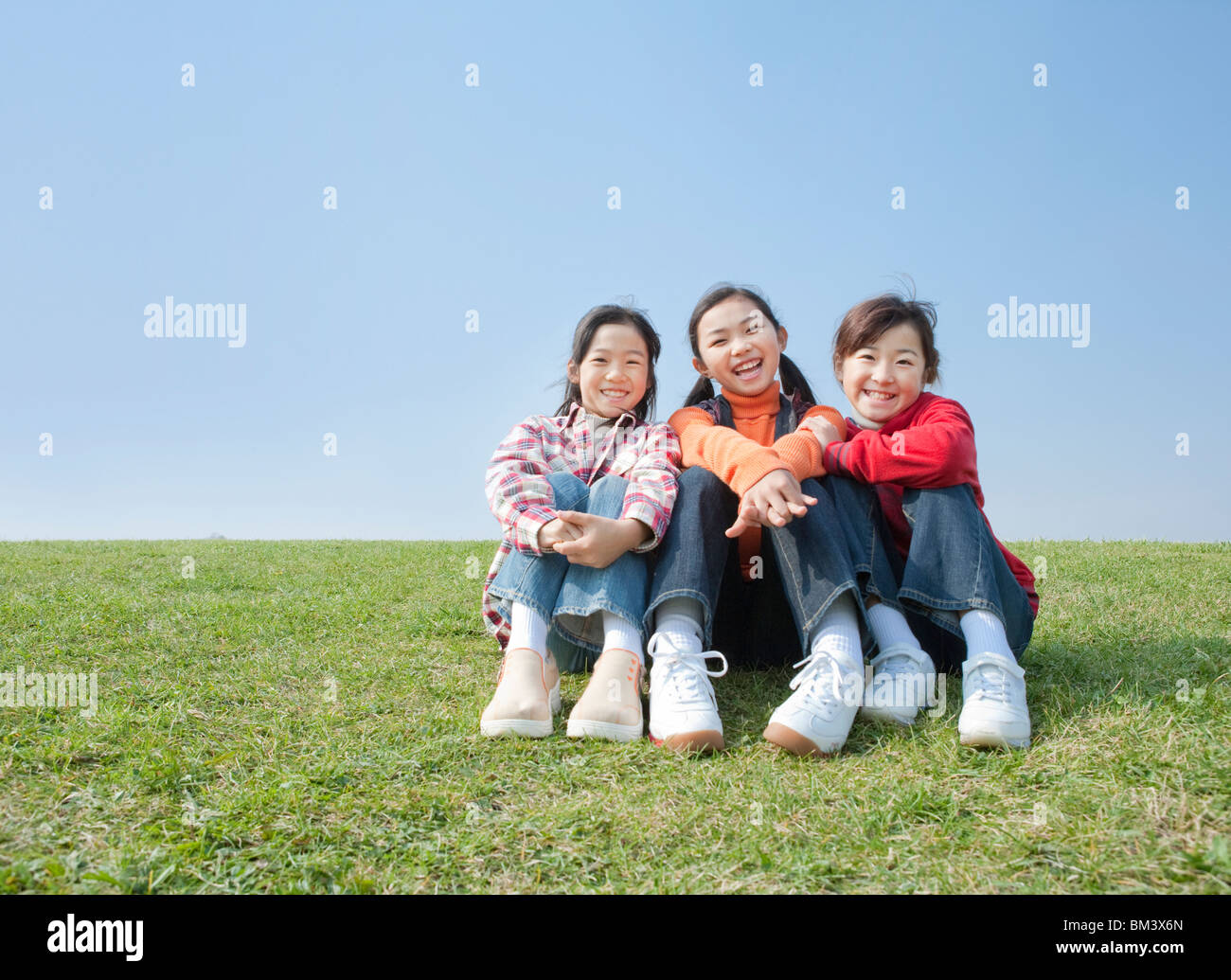 Three girls friends cuddling on hi-res stock photography and images - Alamy