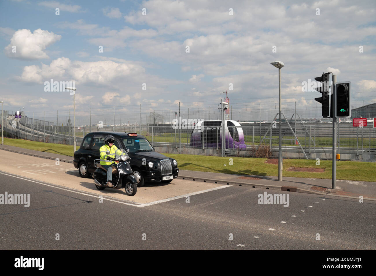 Personal Rapid Transport (PRT) pods pass waiting traffic during testing ...